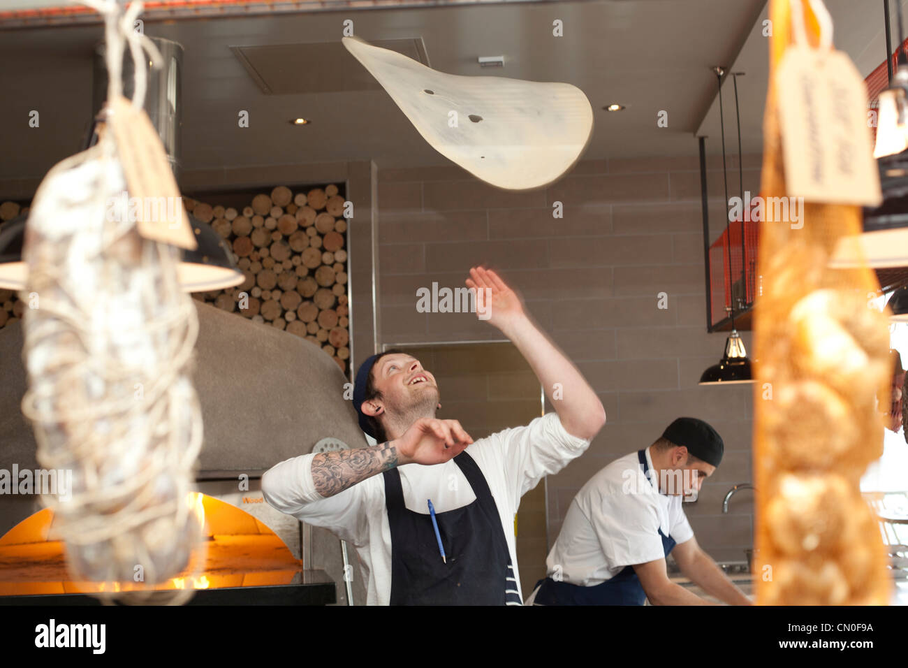 Tossing pizza dough hi-res stock photography and images - Alamy