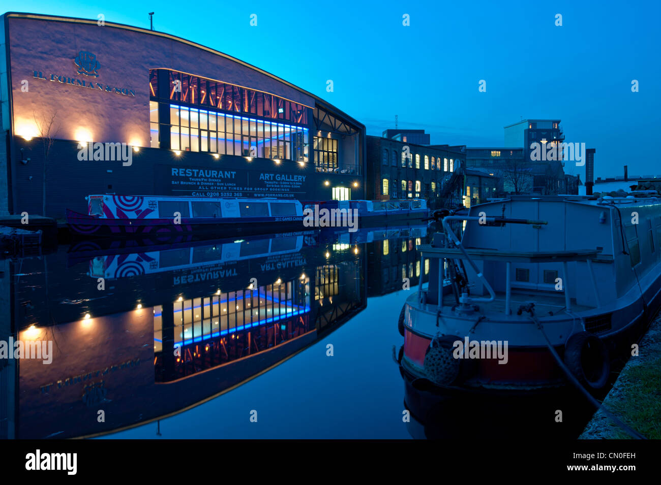 Hackney Wick seen across Lee Navigation at night, London. United ...