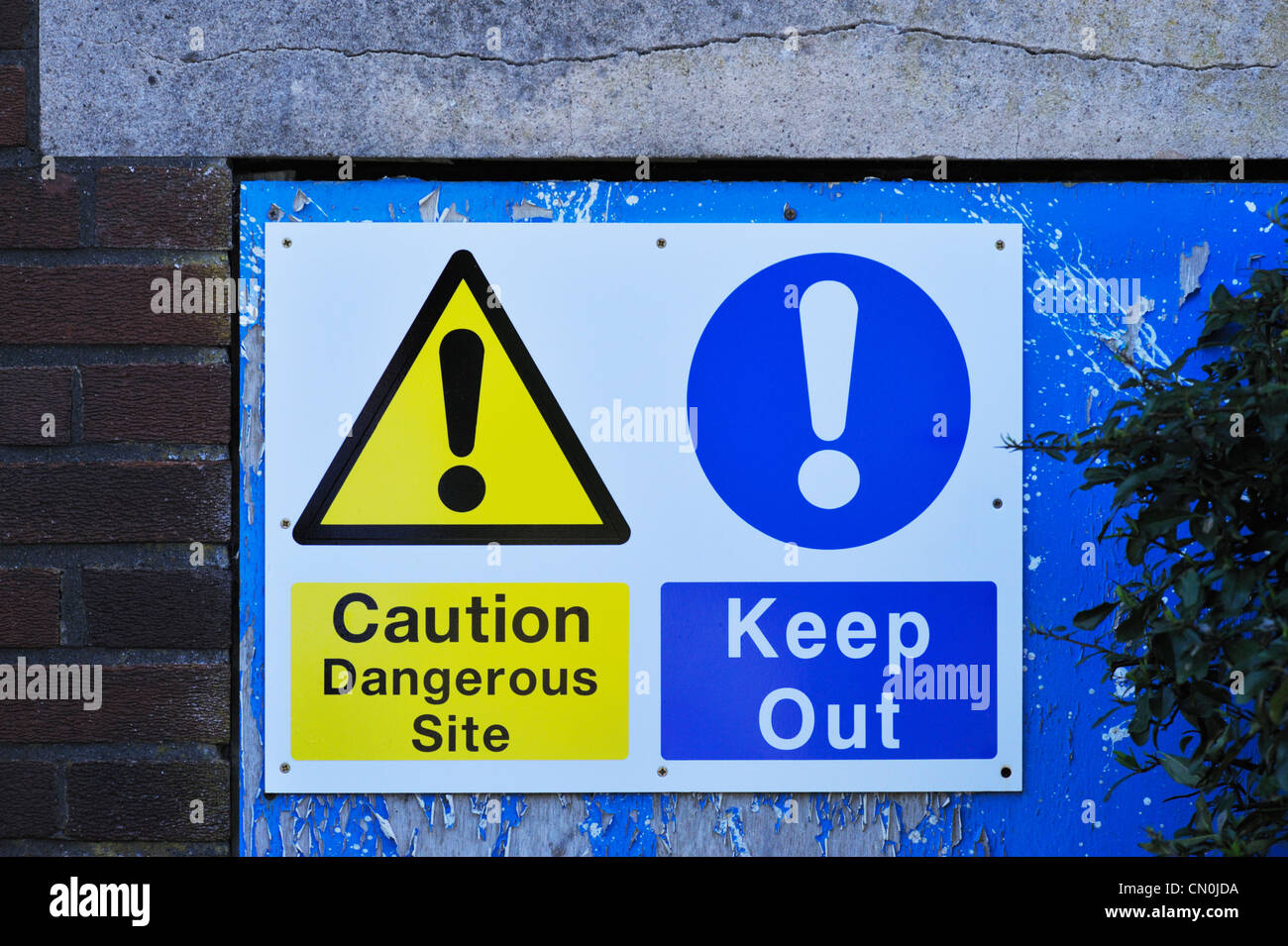'Caution Dangerous Site Keep Out', sign on derelict building.The ...