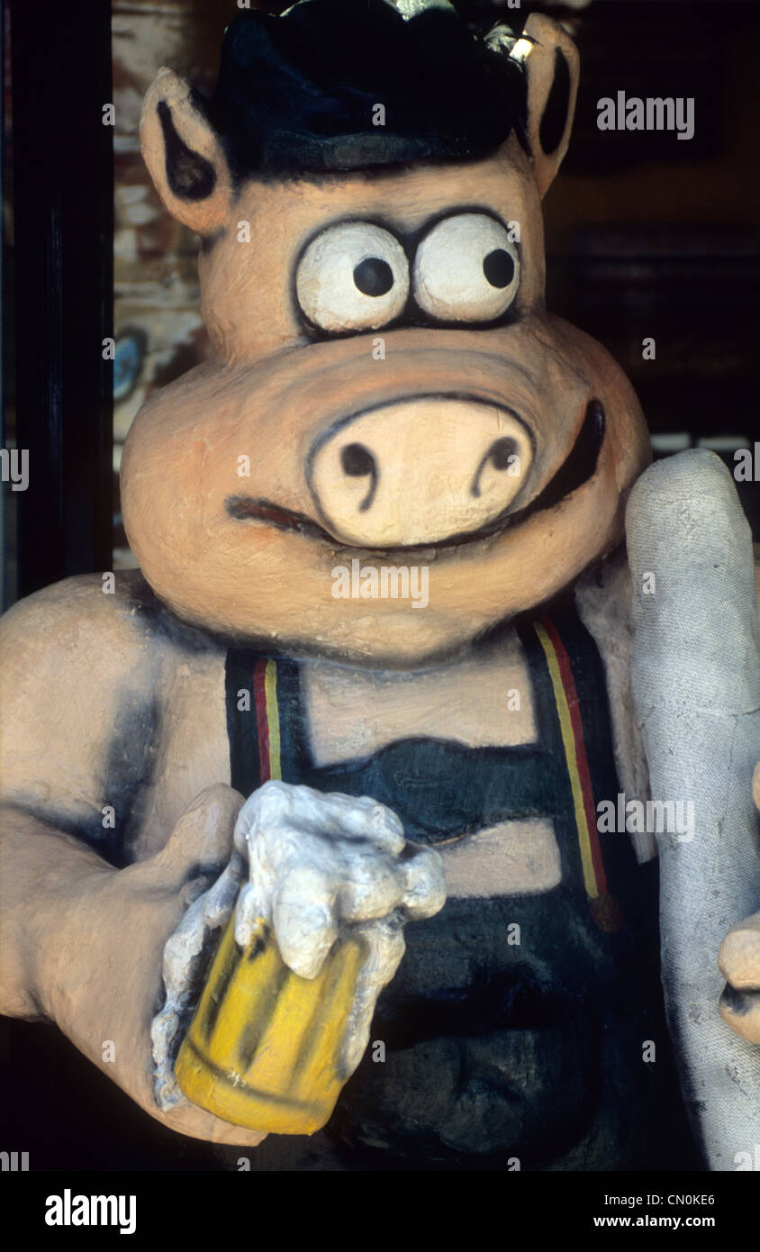 Argentina, Buenos Aires, La Boca, pig with beer outside bar Stock Photo ...