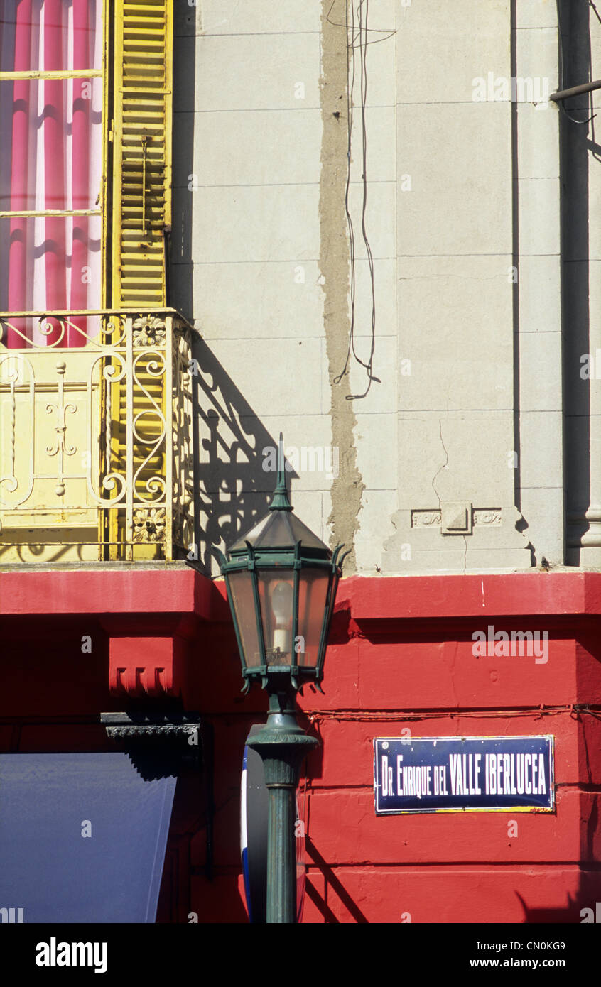 Argentina, Buenos Aires, La Boca, Lamp post and coloured buildings ...