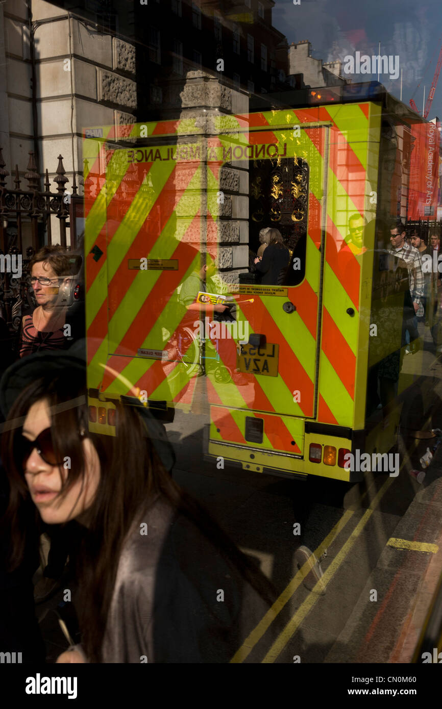 Reflections of londoners and the reflected rear of an NHS London ...