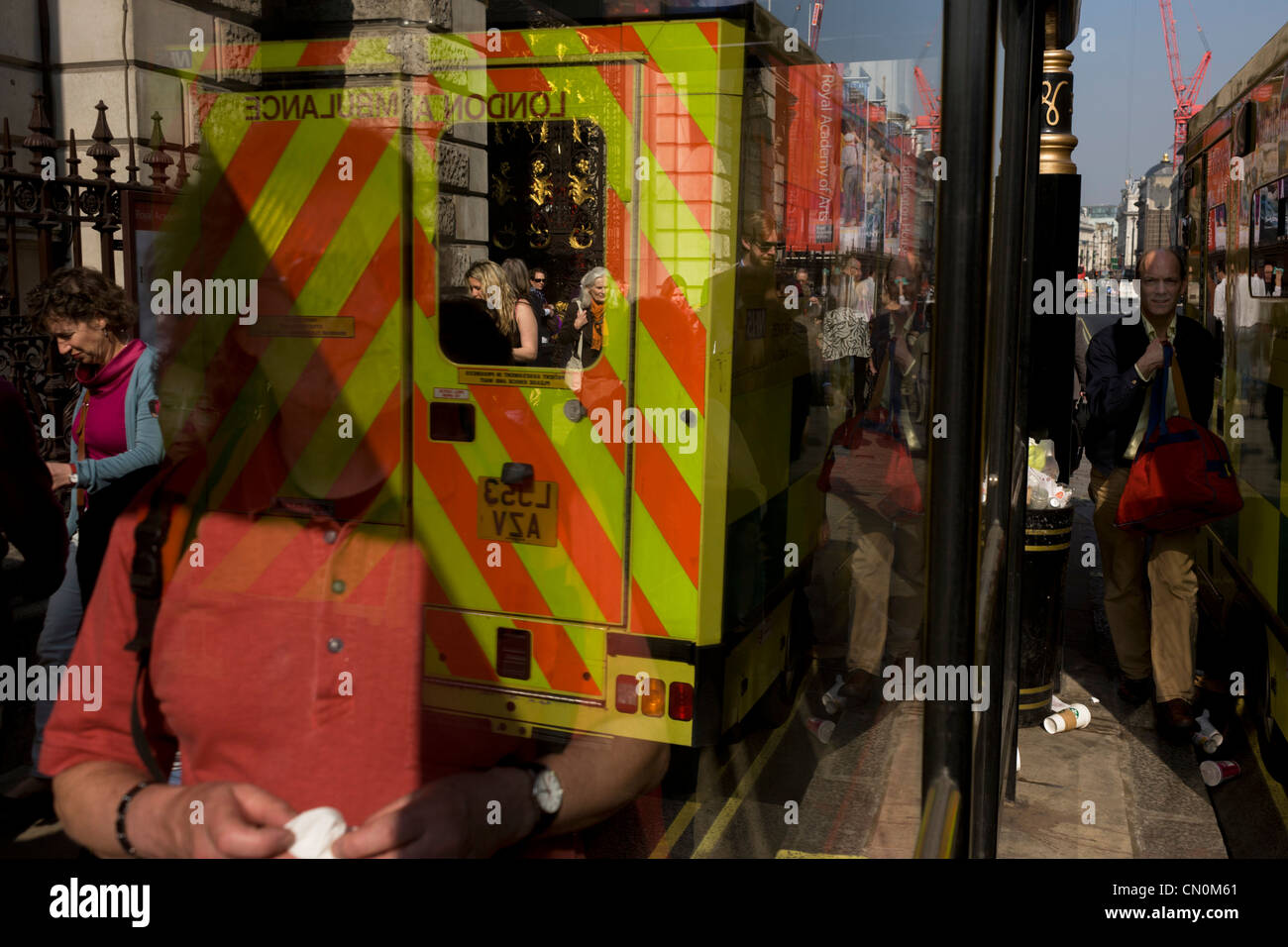 Reflections of londoners and the reflected rear of an NHS London ...