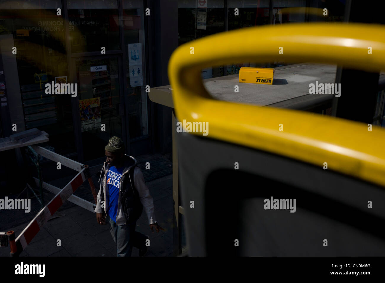 London buses and yellow seating handles from the top deck of a double ...
