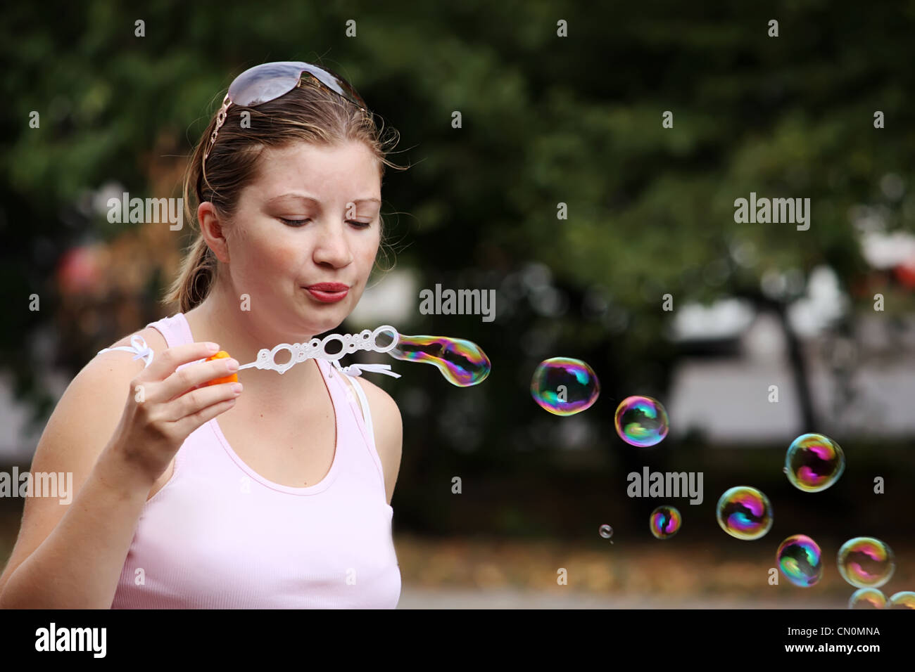 Woman blows bubbles in hi-res stock photography and images - Alamy
