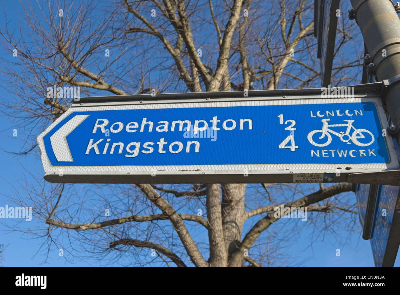 london network cycle sign giving direction and distances to roehampton ...