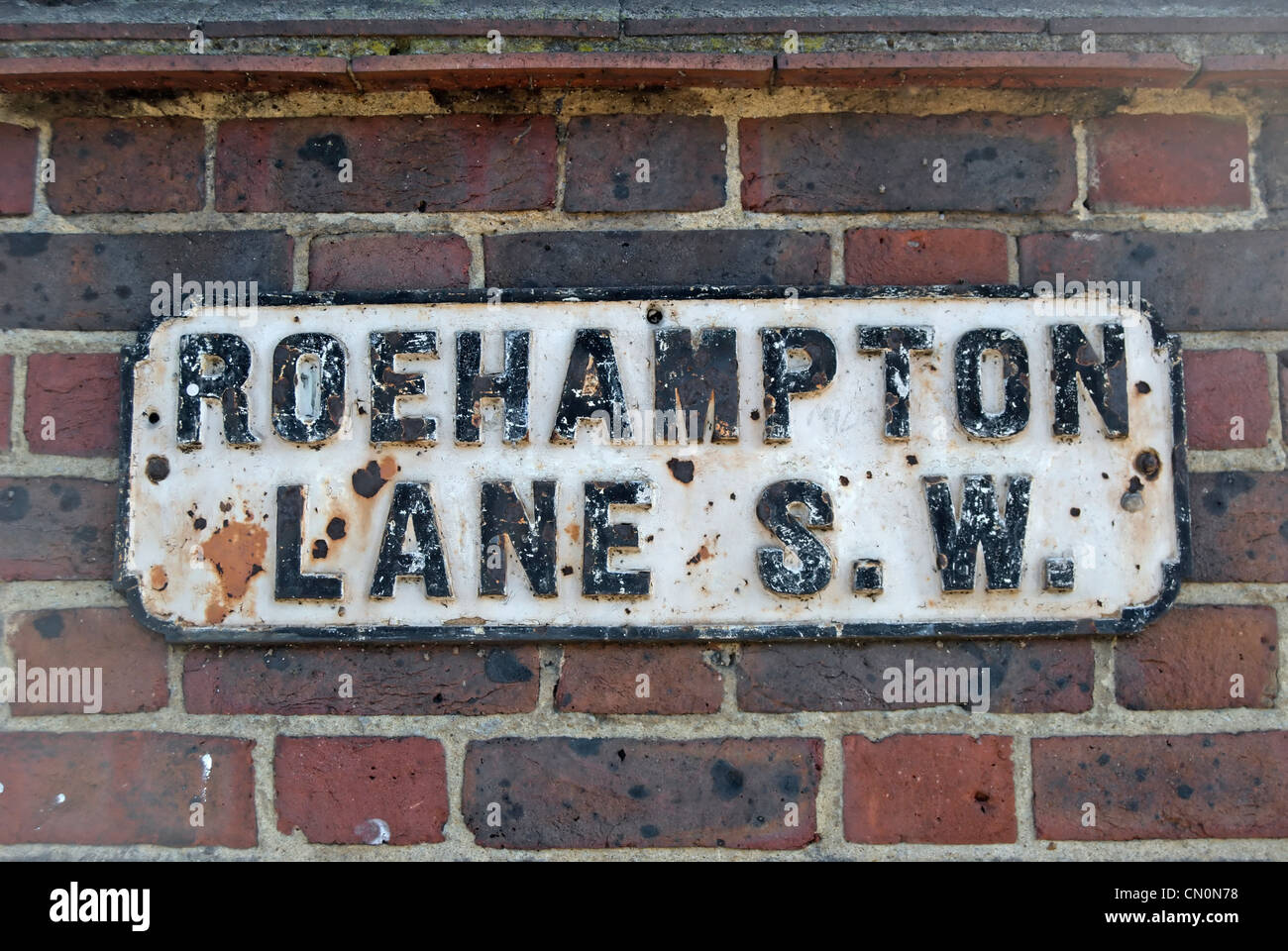 ageing rusted street name sign for roehampton lane, southwest london ...