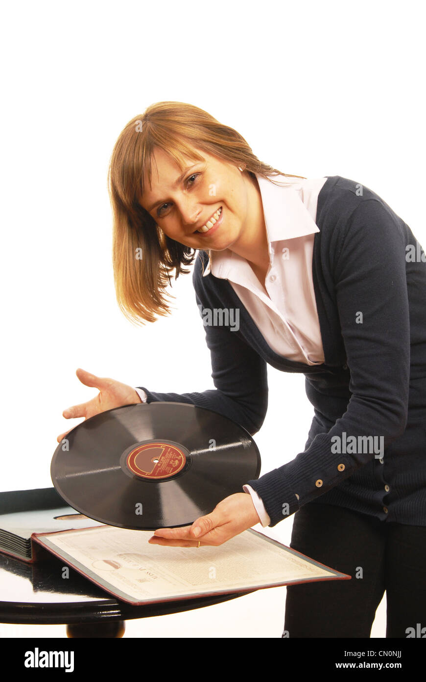 Woman presents old gramophone plate Stock Photo - Alamy