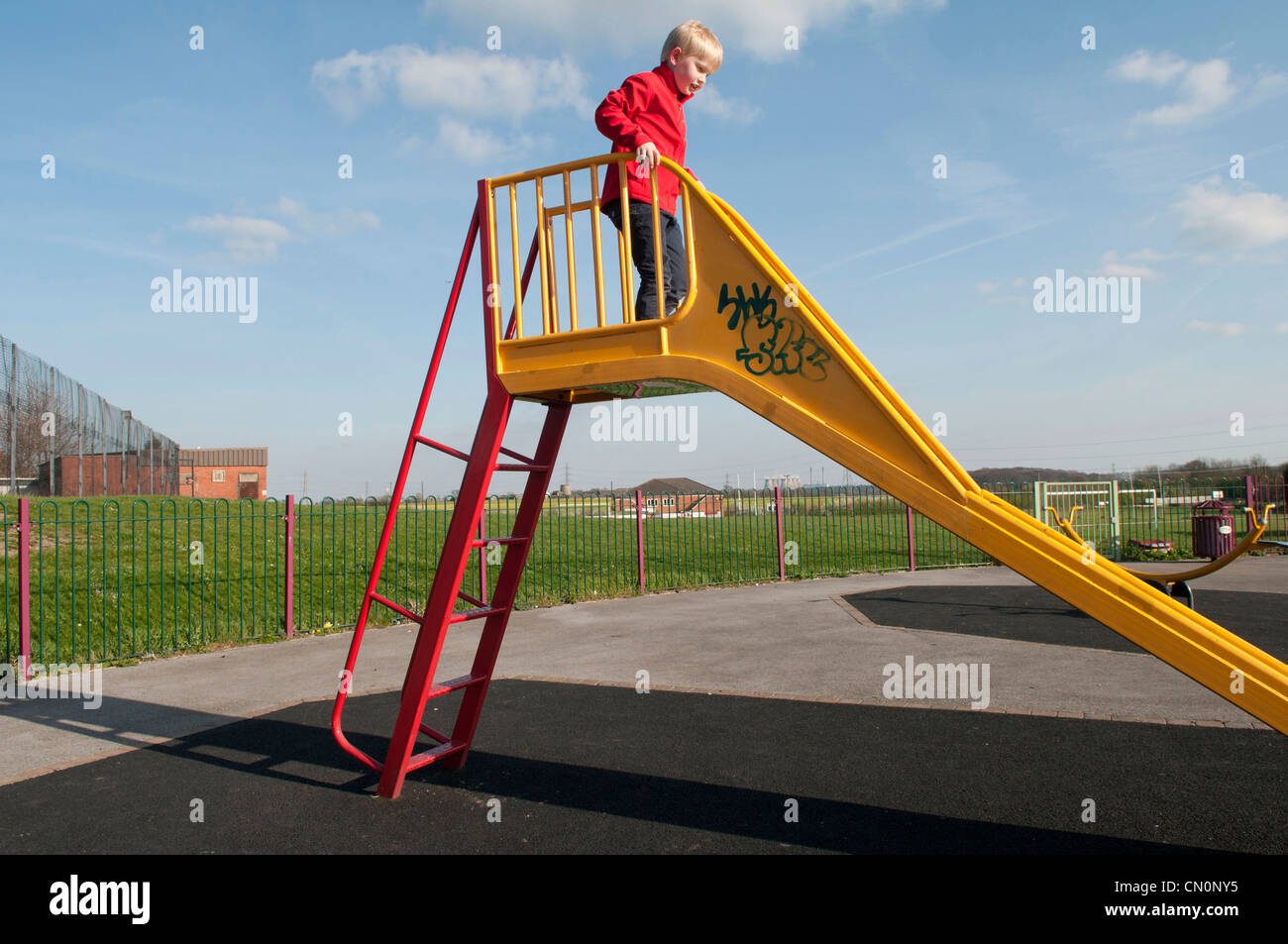 Boy on slide (part of sequence of 10 Stock Photo - Alamy