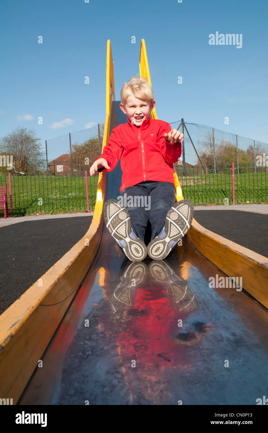 Boy on slide (part of sequence of 10 Stock Photo - Alamy