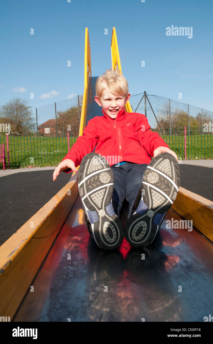 Boy on slide (part of sequence of 10 Stock Photo - Alamy