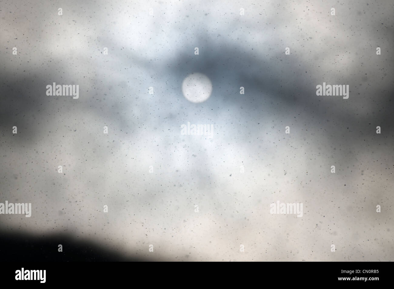 Snow falling infront of the sun Stock Photo - Alamy