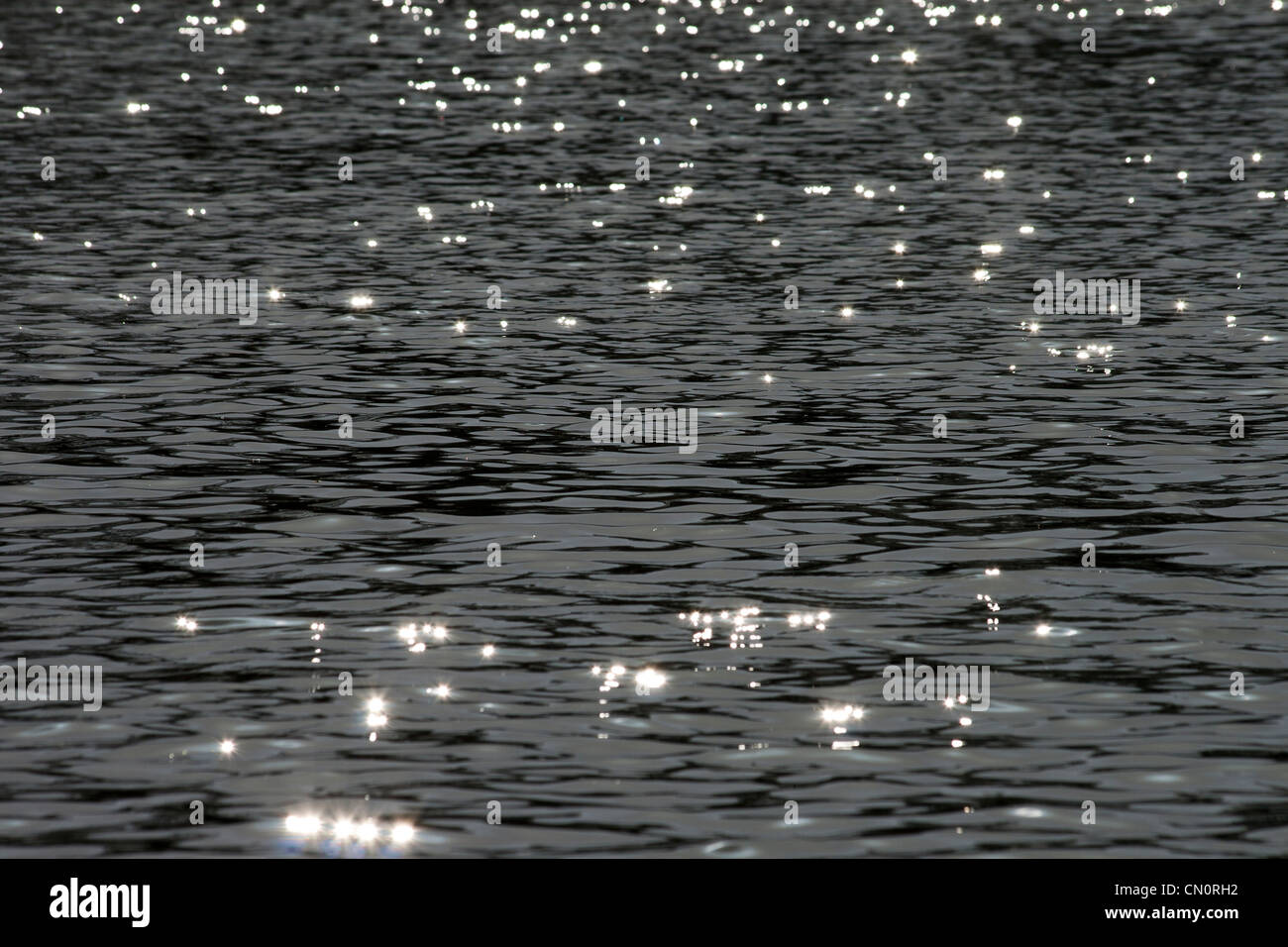 Sunlight reflecting off water Stock Photo - Alamy