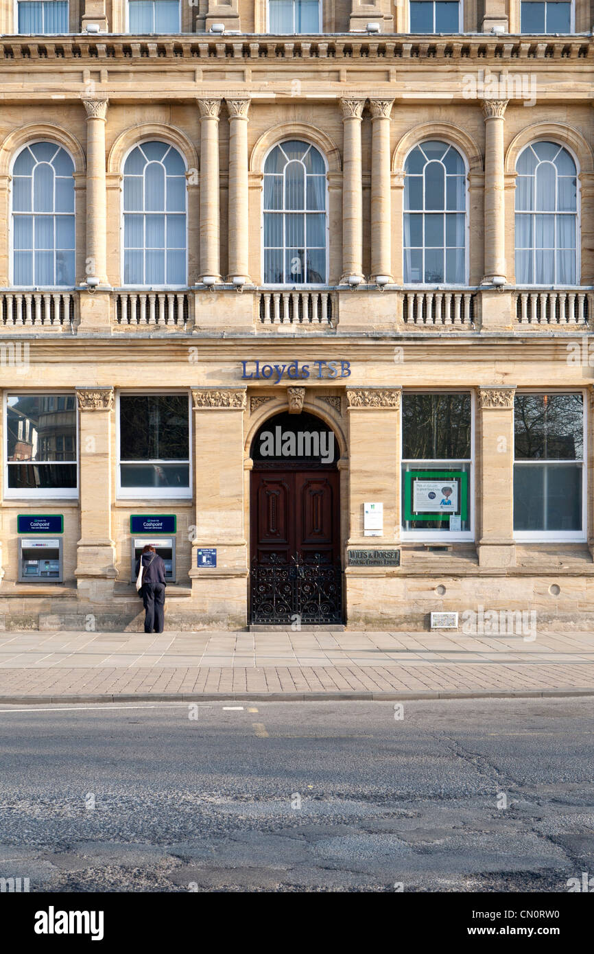 Branch of Lloyds TSB bank with person using ATM cash machine Stock ...