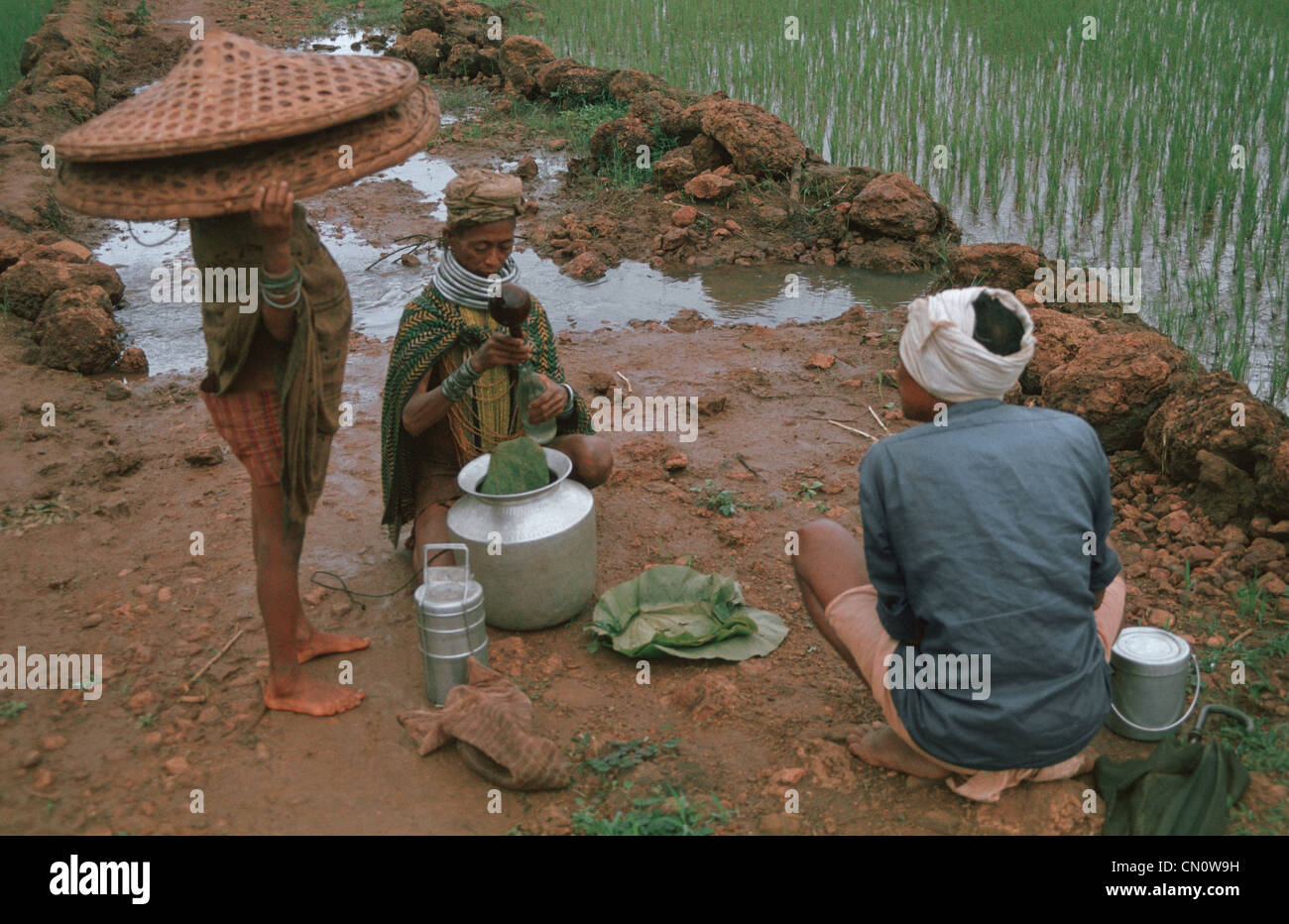 A Bonda tribal woman is selling home made alcohol while on her way to ...