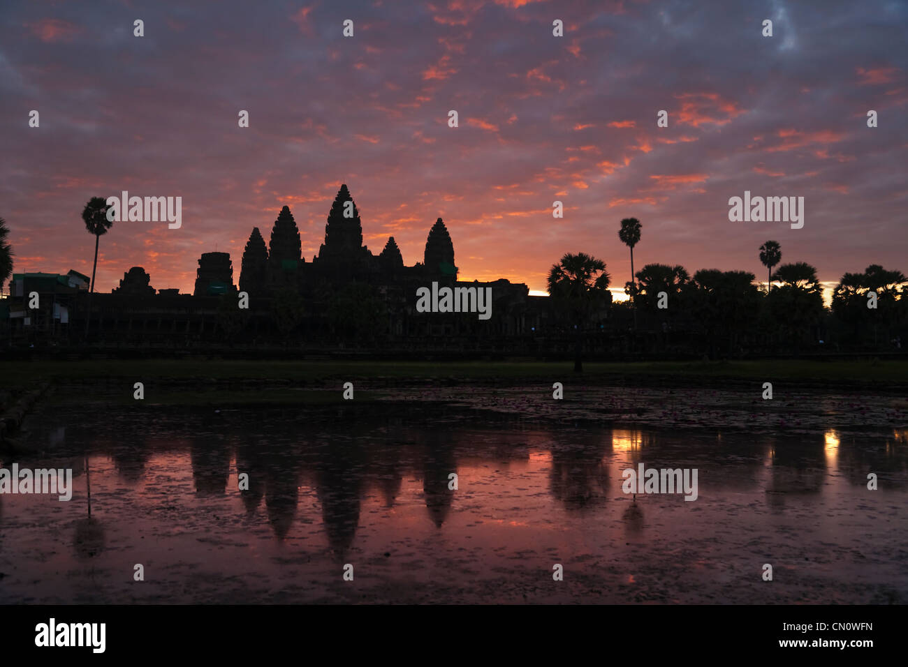 Towers of Angkor Wat and reflection in the river at sunrise, UNESCO ...