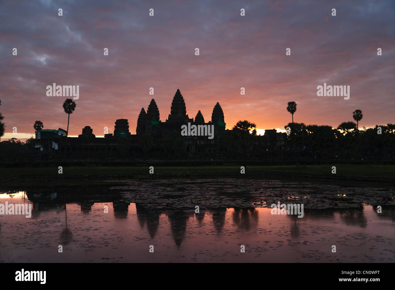 Towers of Angkor Wat and reflection in the river at sunrise, UNESCO ...
