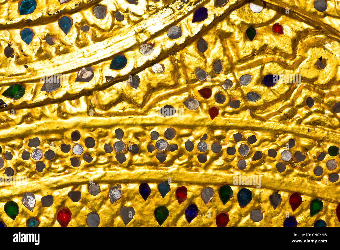 Native art carved on the wall in the temple Stock Photo - Alamy