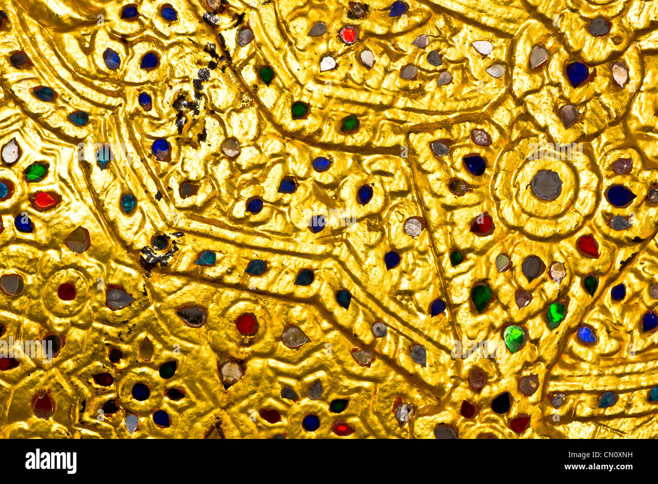 Native art carved on the wall in the temple Stock Photo - Alamy