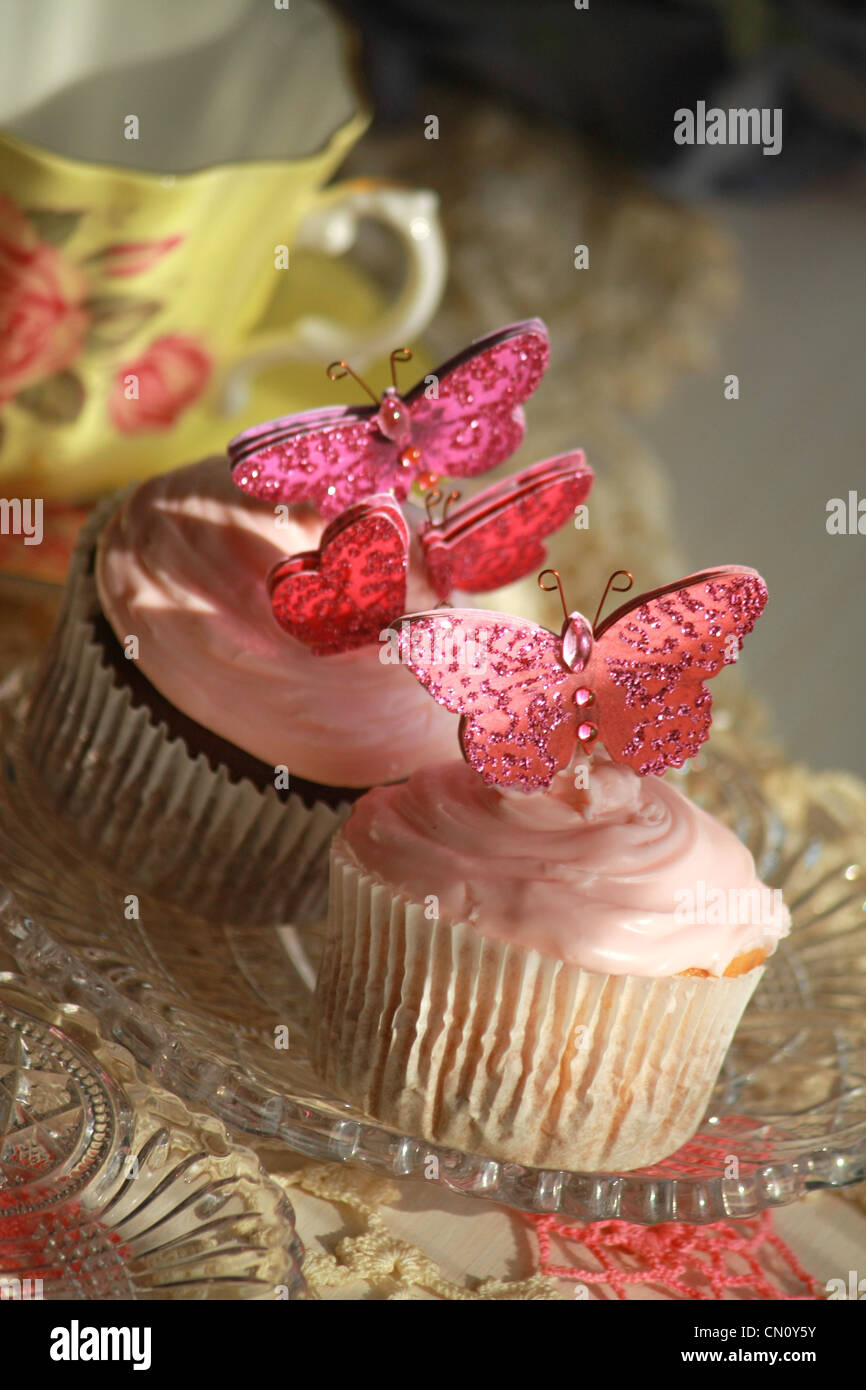 Pink Cupcakes with Butterfly Embellishment Stock Photo - Alamy
