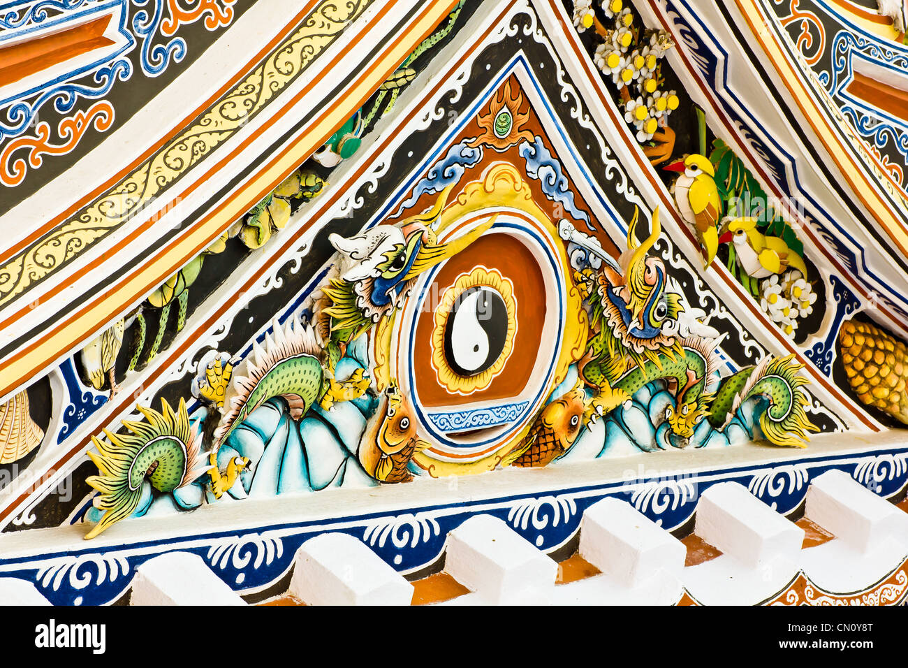 Native art carved on the wall in the temple Stock Photo - Alamy