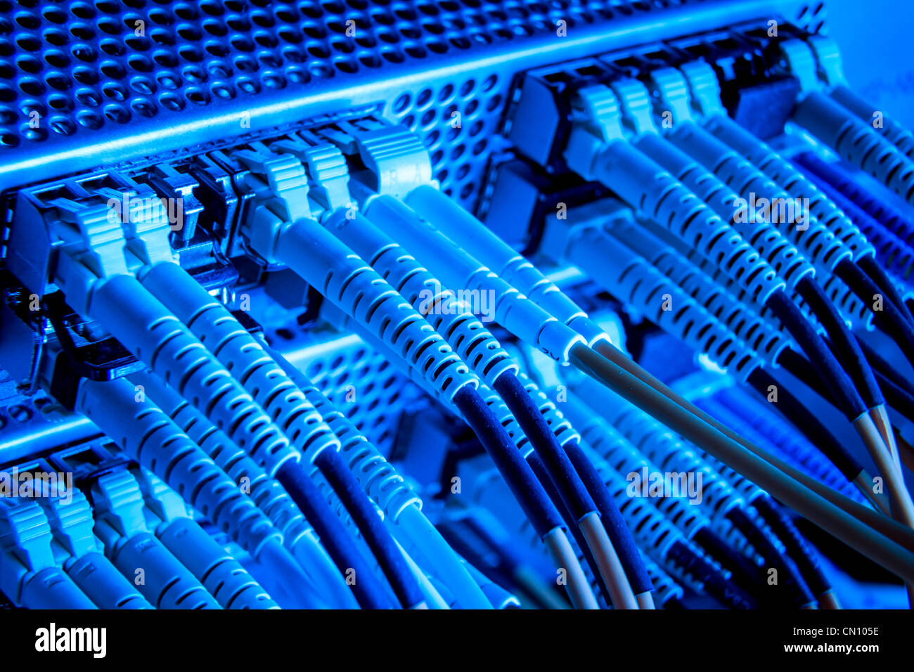 optic fiber cables connected to hub Stock Photo - Alamy