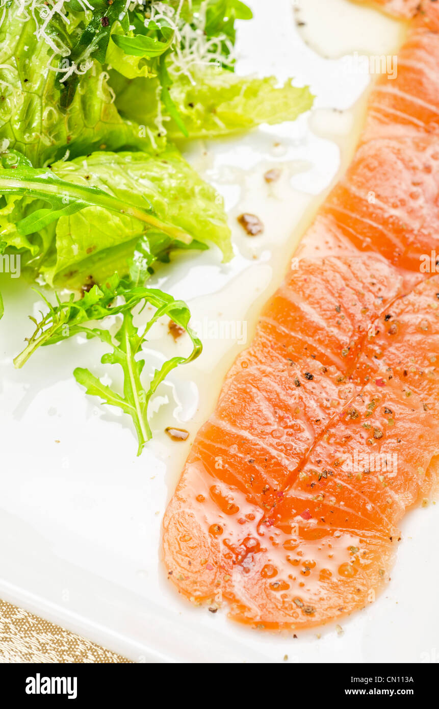 Fish Carpaccio with salad and mozzarella Stock Photo - Alamy
