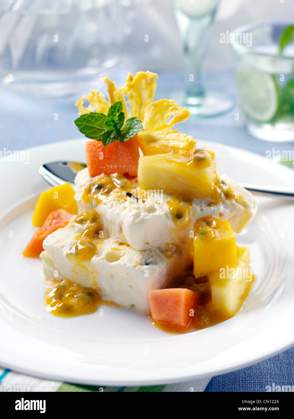 Individual mango pineapple passion fruit salad hi-res stock photography ...