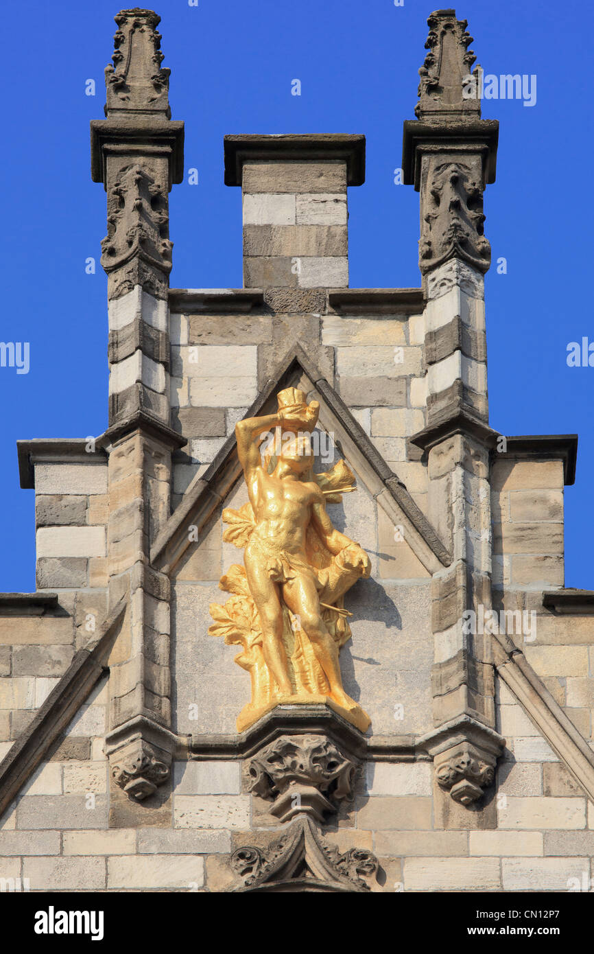 A guildhall topped by a gilded statue of Saint Sebastian at the Market ...