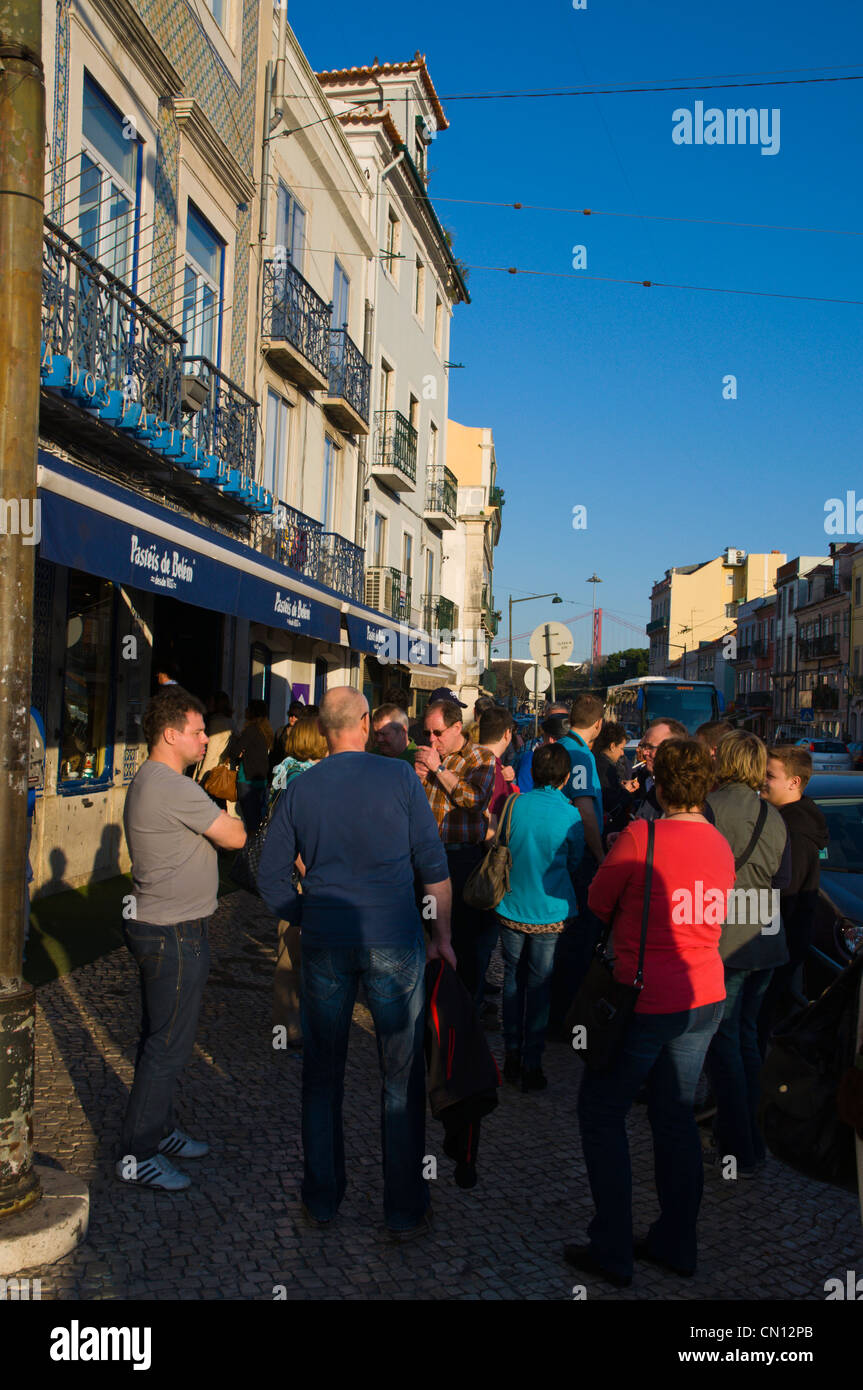 People outside Pasteis de Belem cafe along Rua de Belem street Belem ...