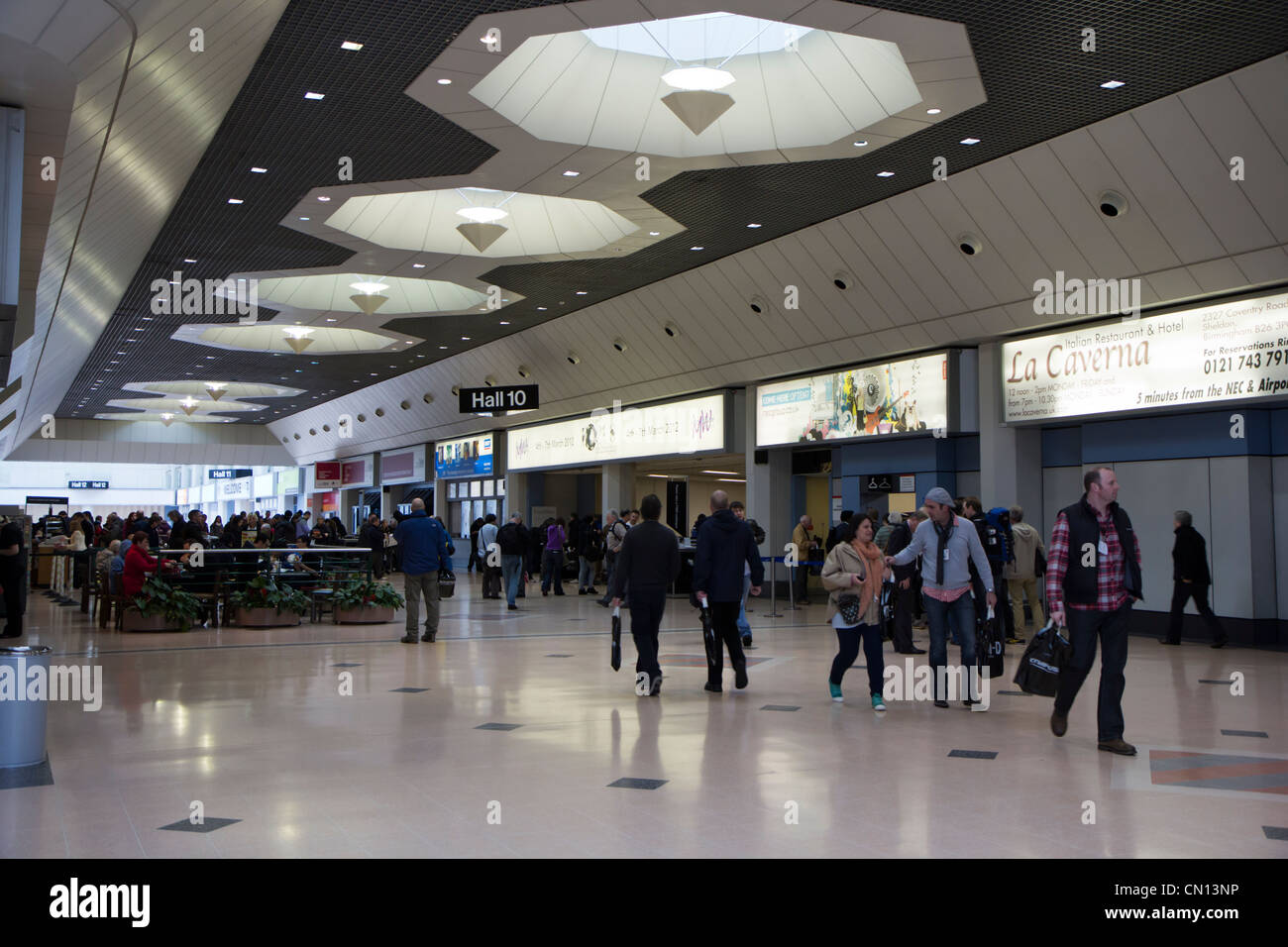 Interior of Birmingham NEC exhibition hall with crowds of people Stock ...