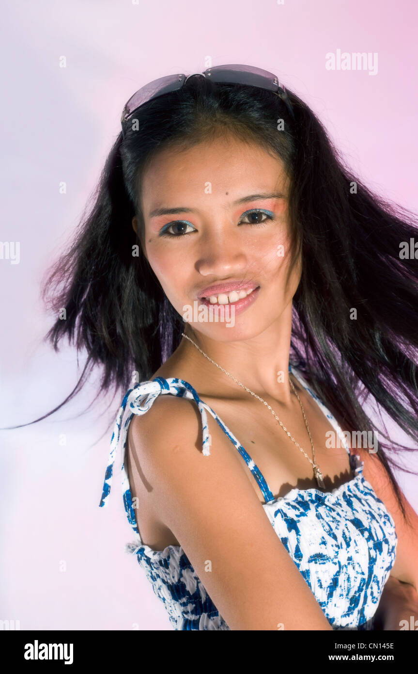 Asian fashion model in studio setting Stock Photo - Alamy