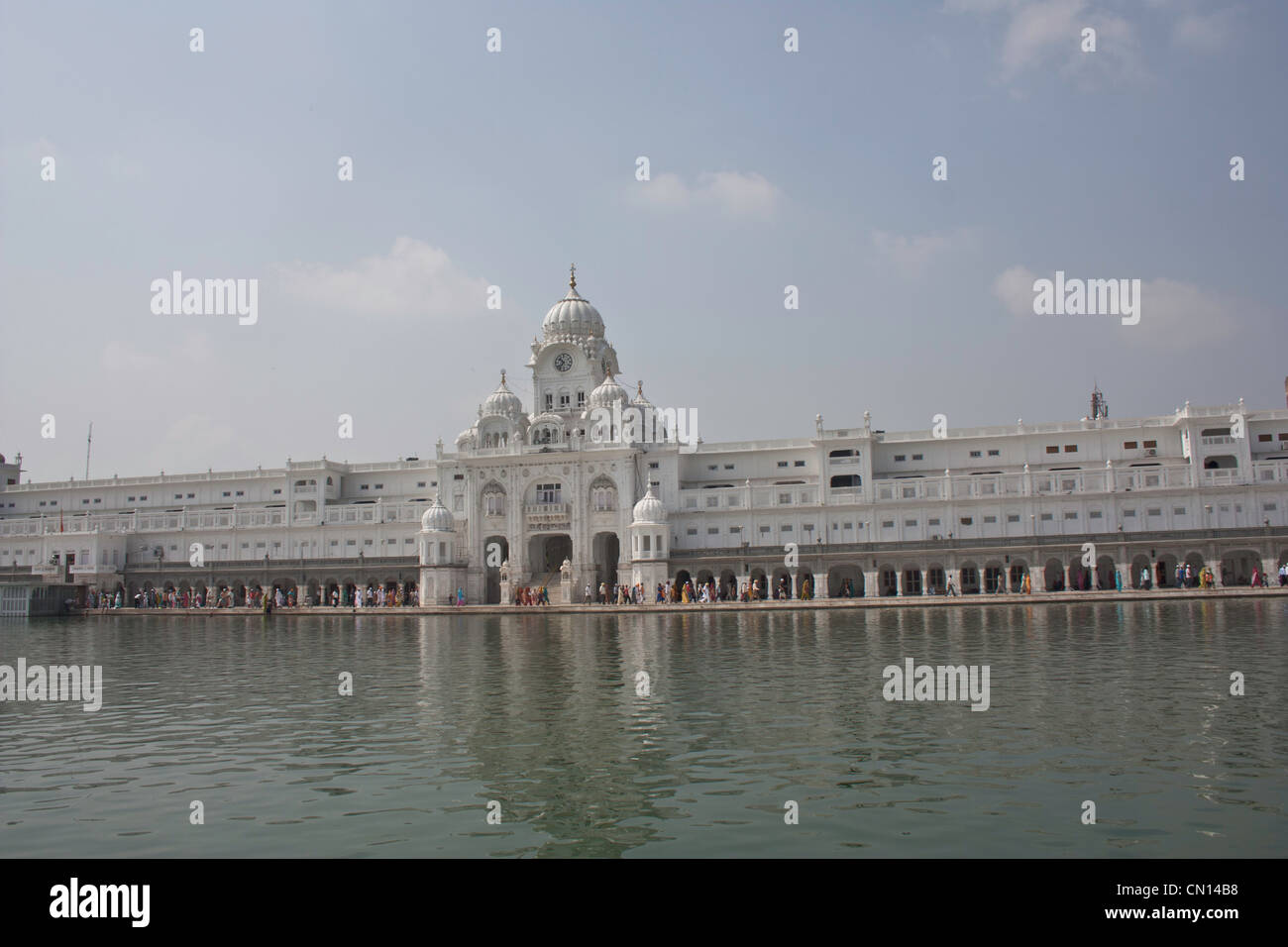 White clocktower building inside the Golden Temple. This is one of the ...