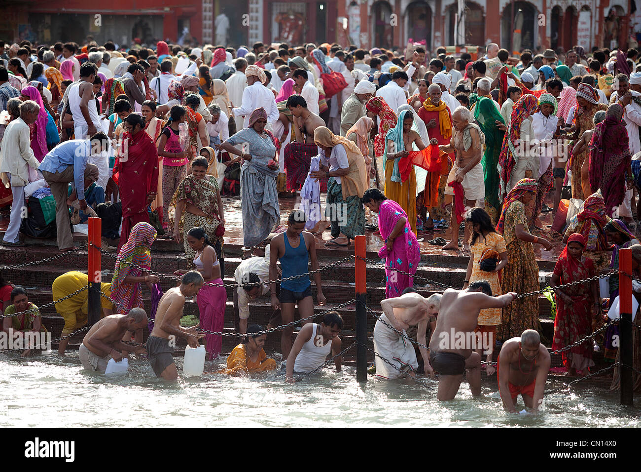 People bathing in the sacred Ganges river in the festival of Kumbh Mela ...