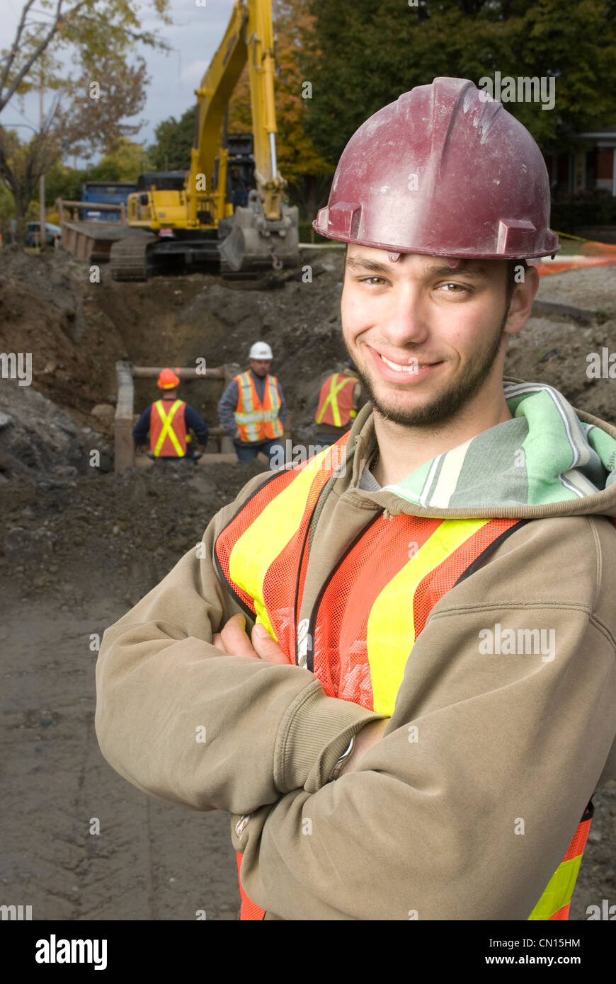 Construction worker in front of Crane, Montreal, Quebec Stock Photo - Alamy