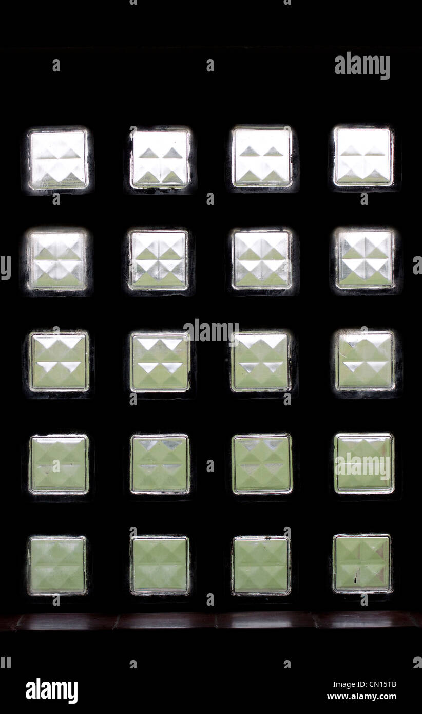 Glass brick windows in the single prison cell of an abandoned rural ...