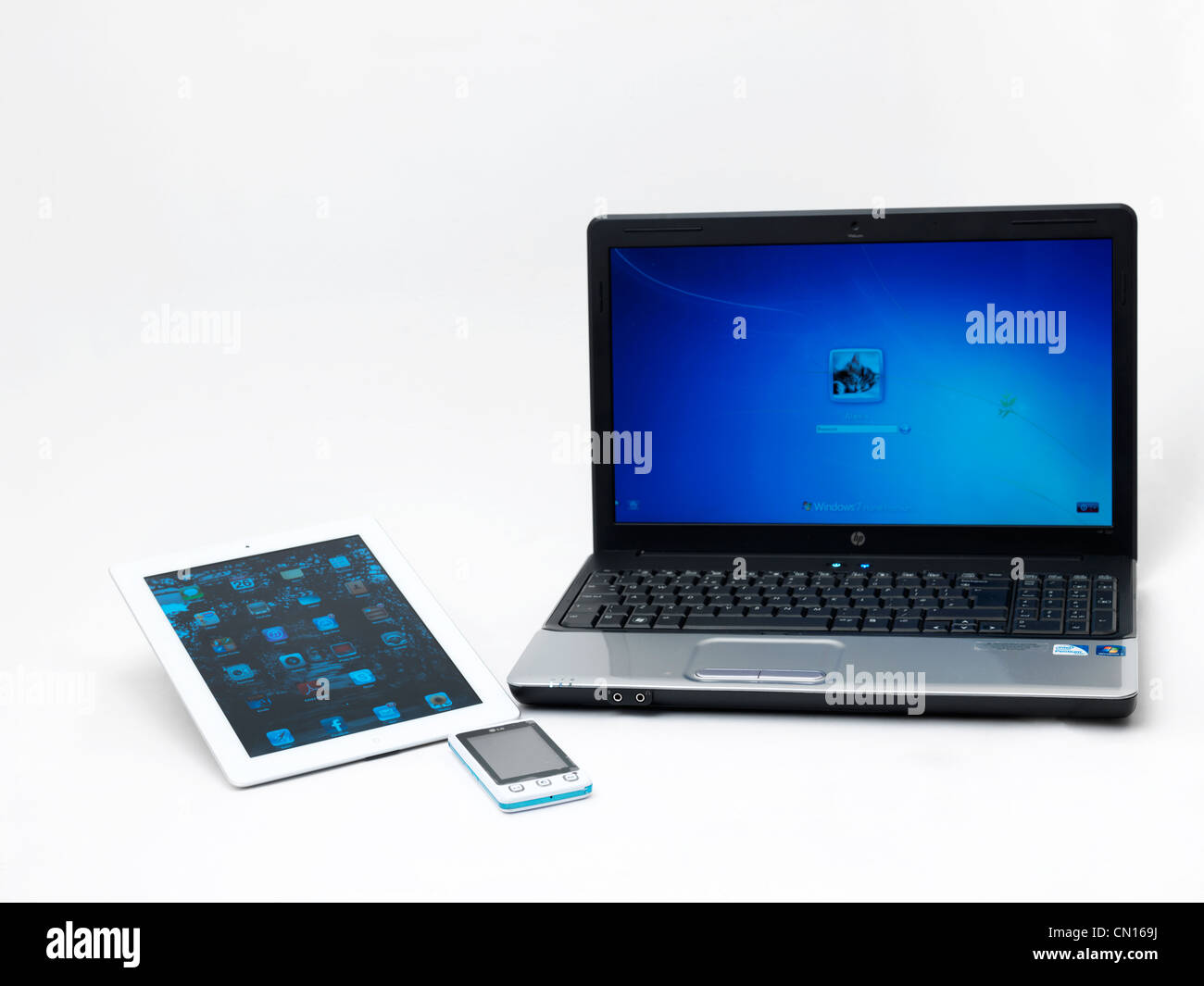 Apple iPad2, LG Mobile Phone And An HP Laptop (Notebook Stock Photo - Alamy