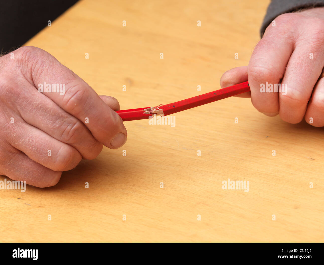 Hands breaking pencil hi-res stock photography and images - Alamy
