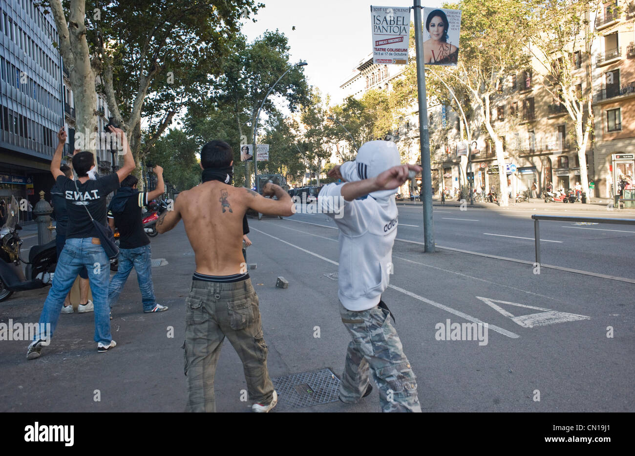 Protesters throwing stones to the riot police during the general strike ...