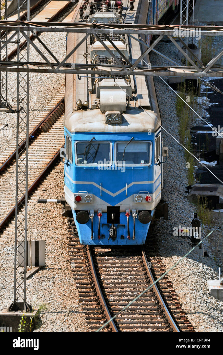Passenger train entering station Stock Photo - Alamy