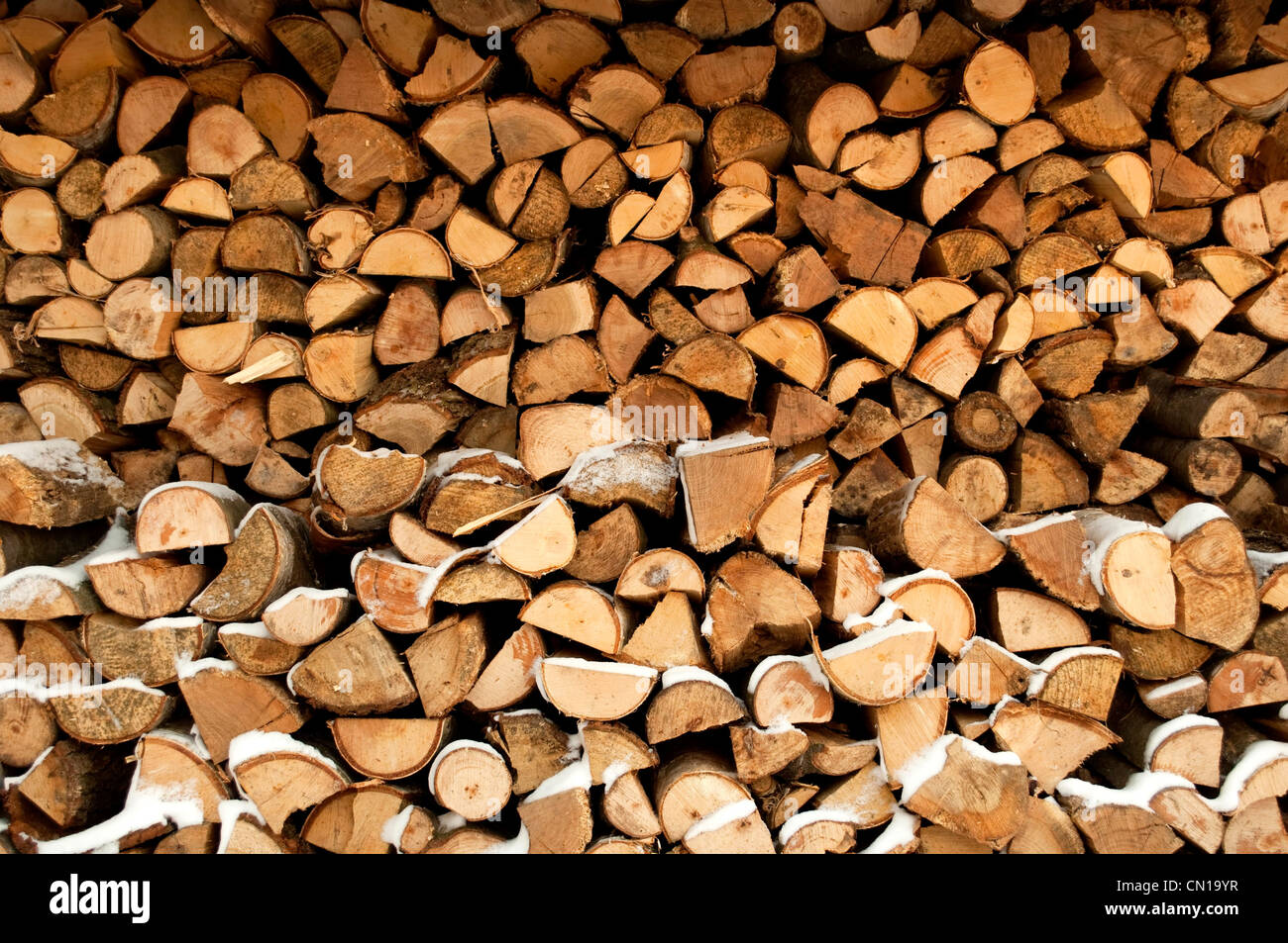 Stacked logs background Stock Photo - Alamy