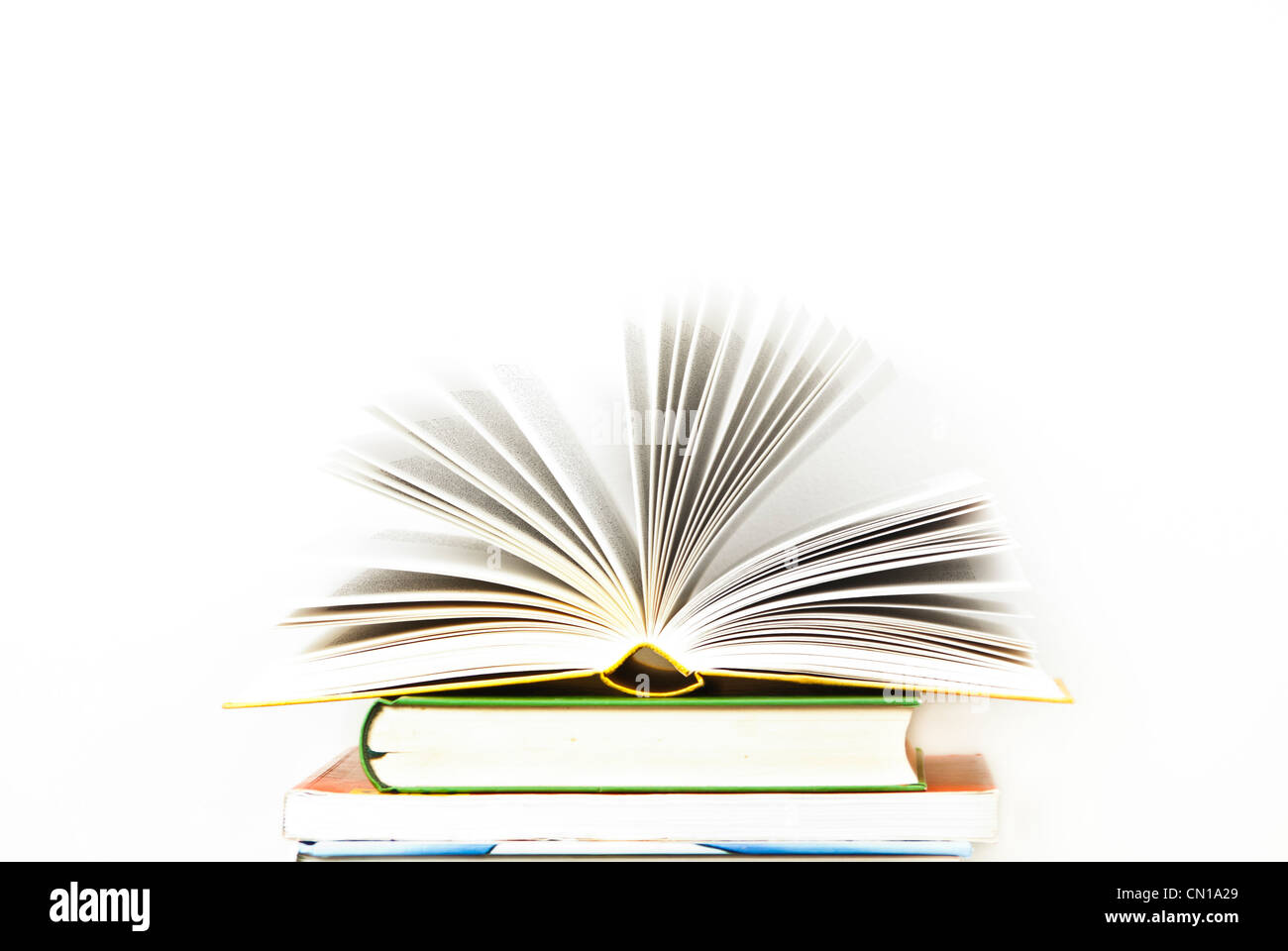 An open book on a stack of books Stock Photo - Alamy