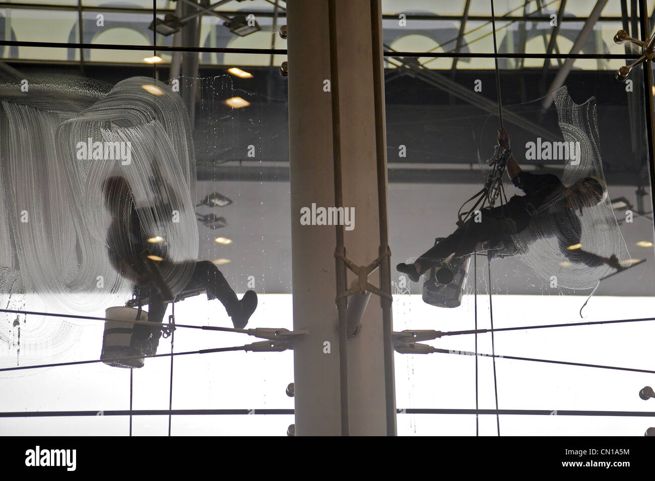 Cleaning the windows at Suvarnabhumi airport, Bangkok, Thailand Stock ...