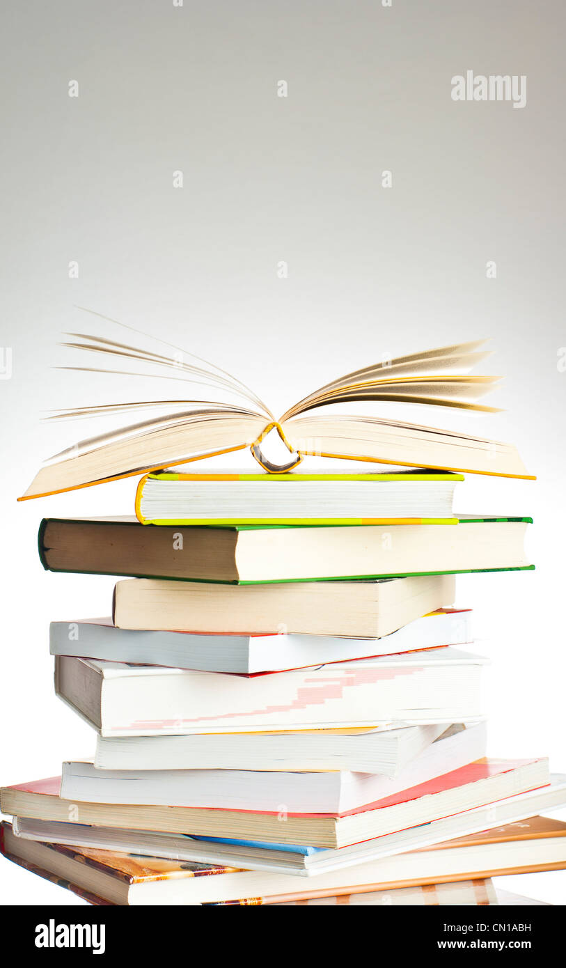 An open book on a stack of books Stock Photo - Alamy