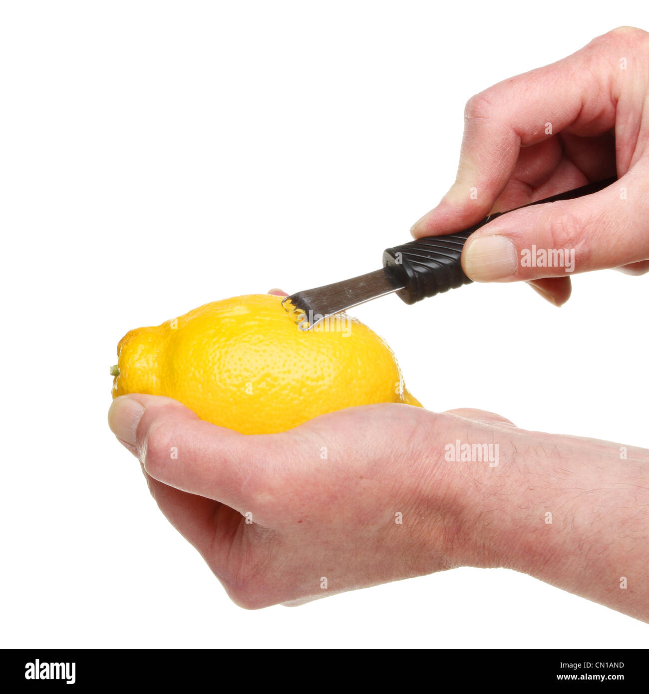 Pair of hands zesting a lemon against a white background Stock Photo ...