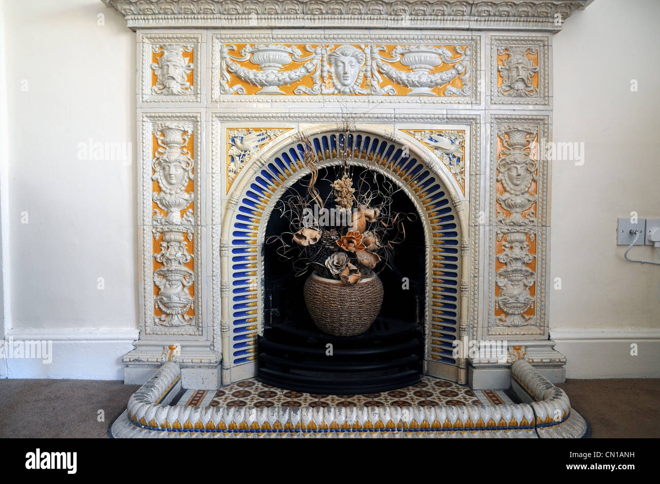 A unique fireplace made from Maw's tiles installed in Room 18 of the ...