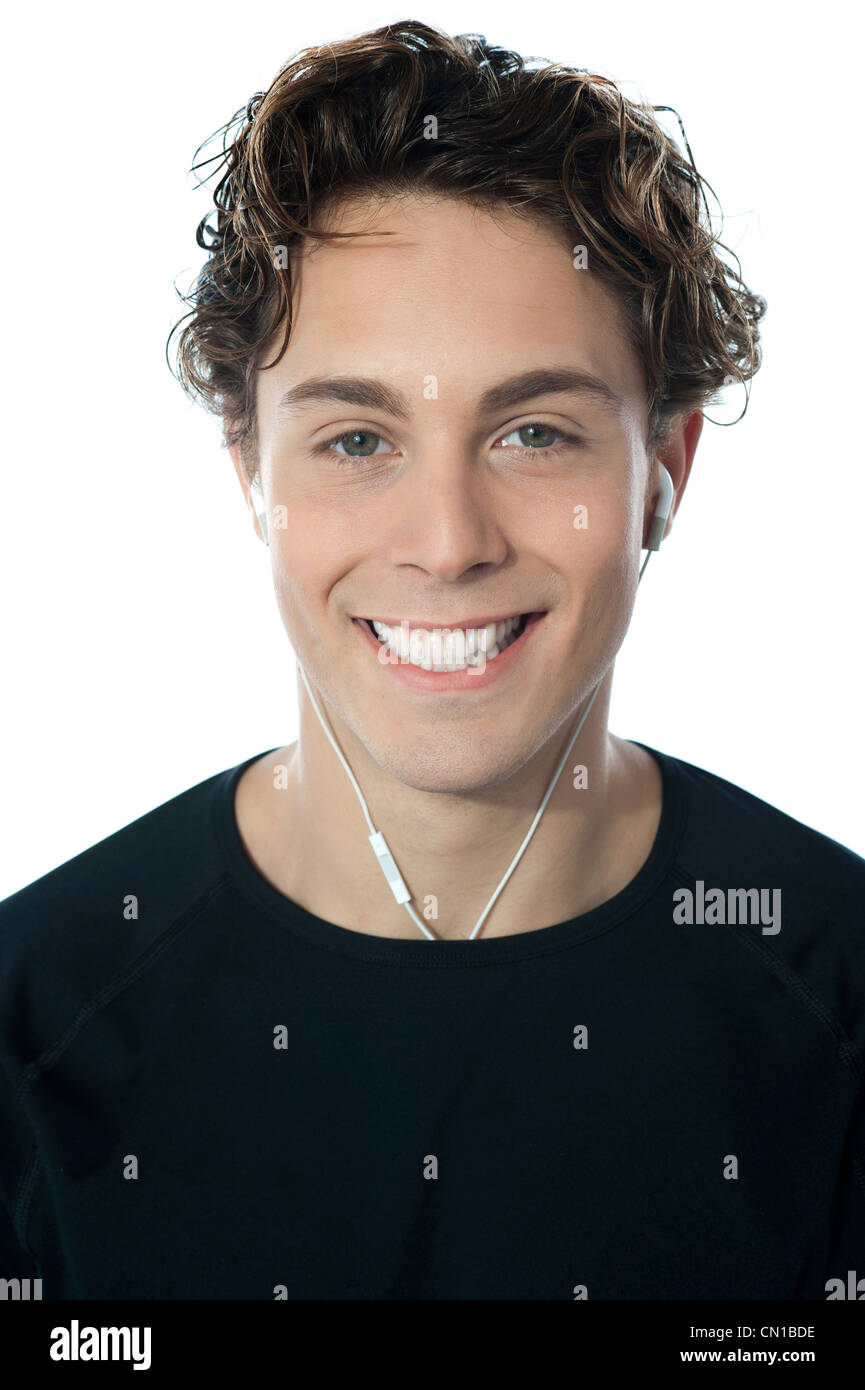 Young handsome guy listening music, closeup portrait Stock Photo - Alamy