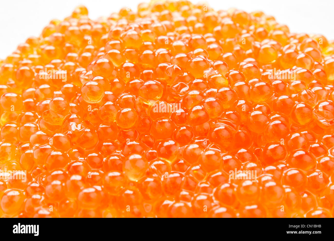Red salmon caviar isolated on a white background Stock Photo - Alamy