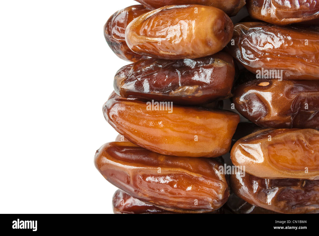 A stack of delicious date fruits on a white background Stock Photo - Alamy