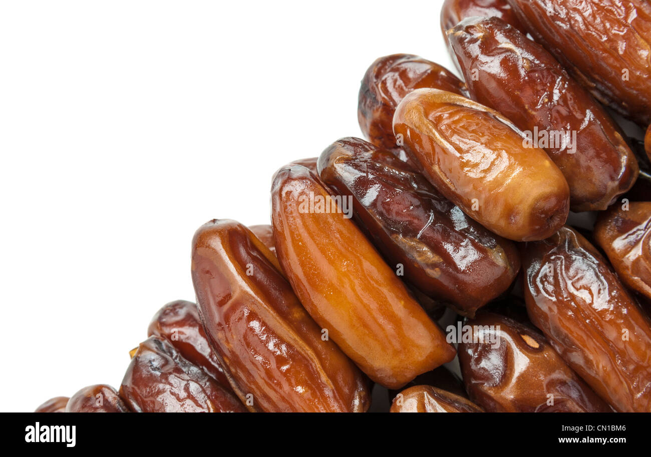 A stack of delicious date fruits on a white background Stock Photo - Alamy